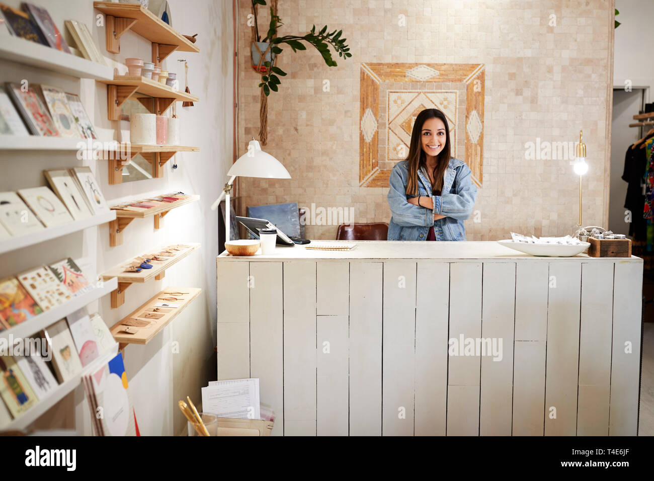 Portrait Of Female Owner Of Independent Clothing And Gift Store Behind ...