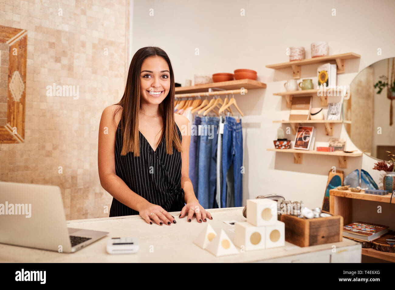 Portrait Of Female Owner Of Independent Clothing And Gift Store Behind ...