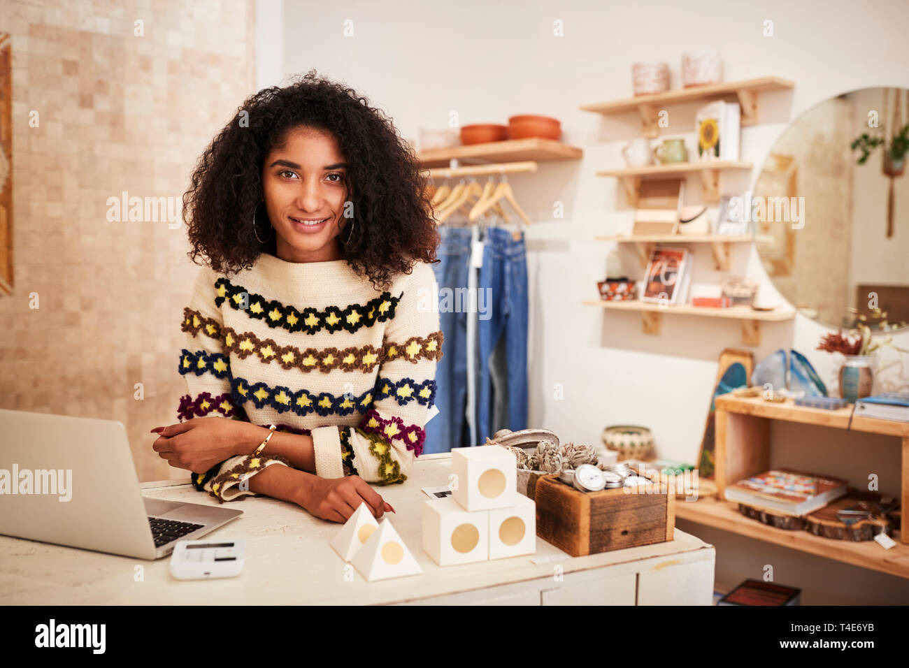 Portrait Of Female Owner Of Independent Clothing And Gift Store Behind ...