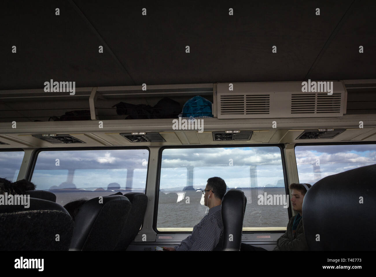 Bus passengers sitting window seat hi-res stock photography and images ...