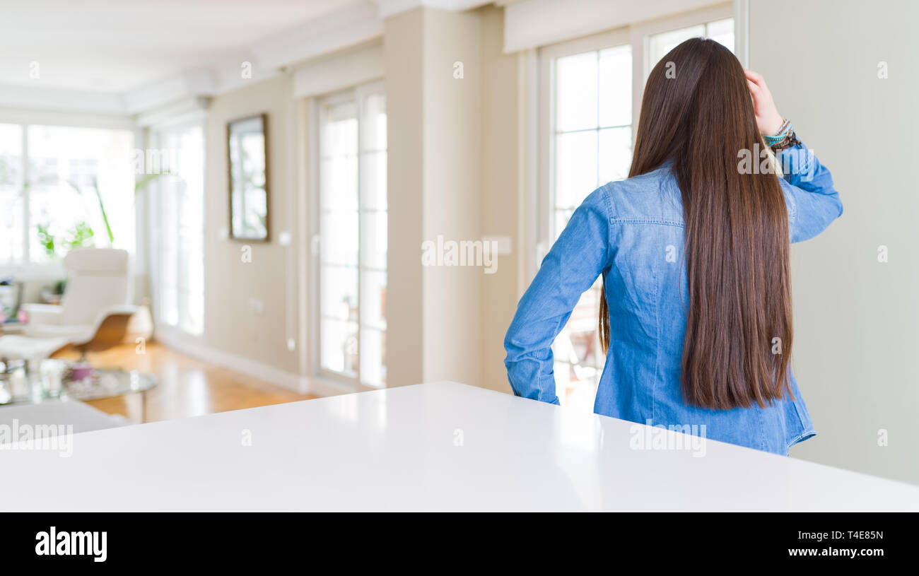 Young beautiful asian woman with long hair wearing denim jacket ...
