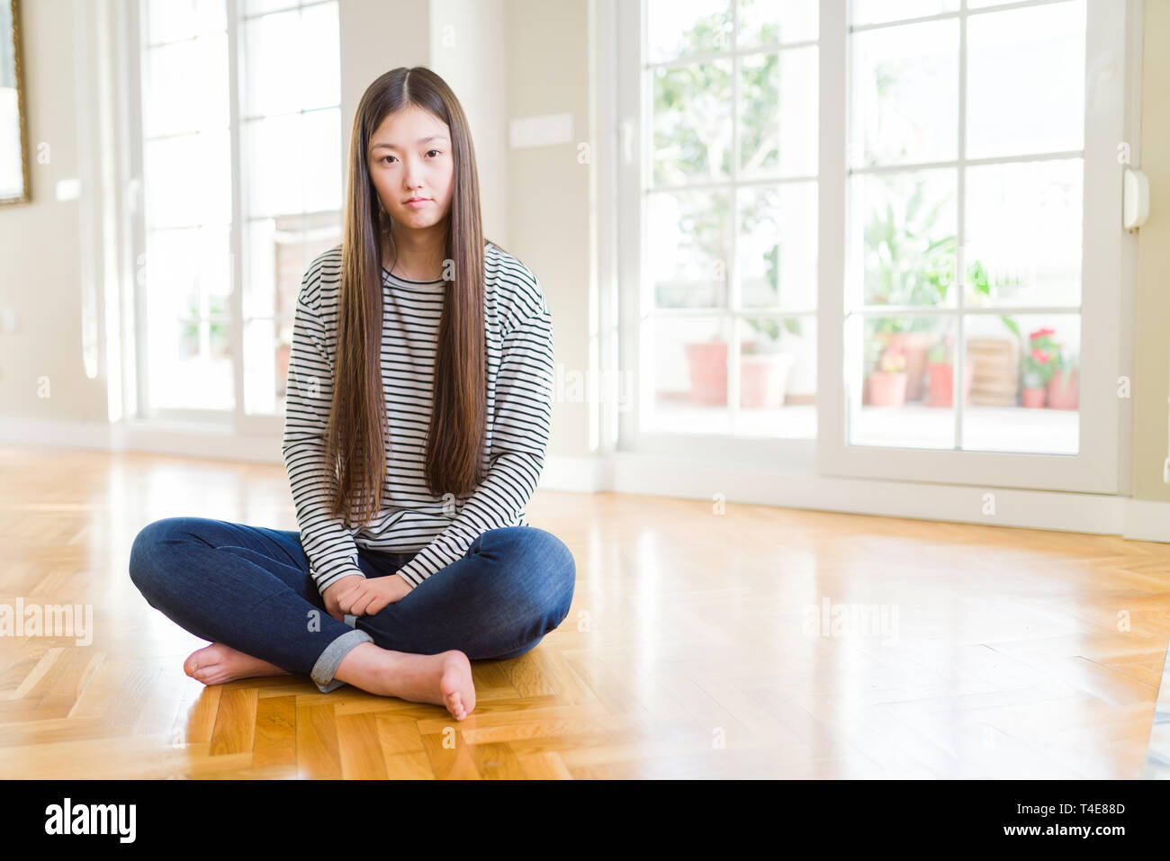 Chinese woman sitting floor barefoot hi-res stock photography and ...