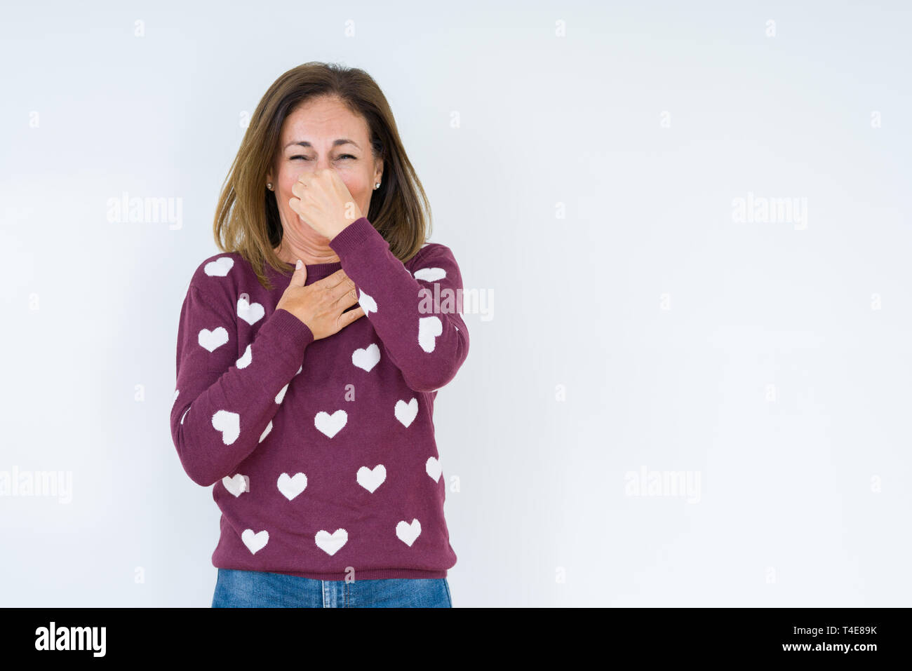 Beautiful middle age woman wearing heart sweater over isolated ...