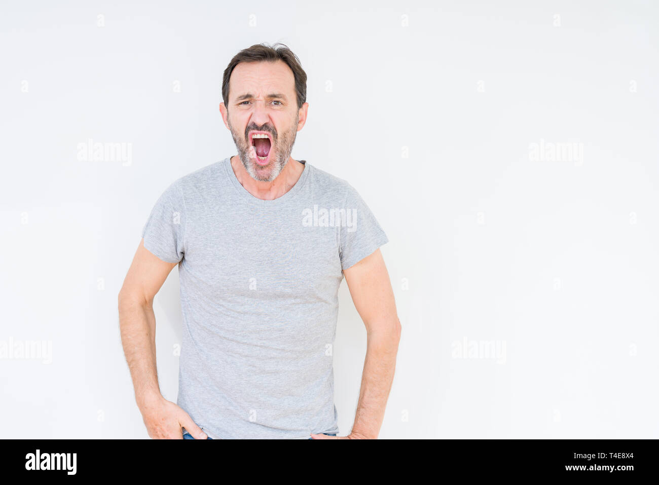 Handsome senior man over isolated background In shock face, looking ...