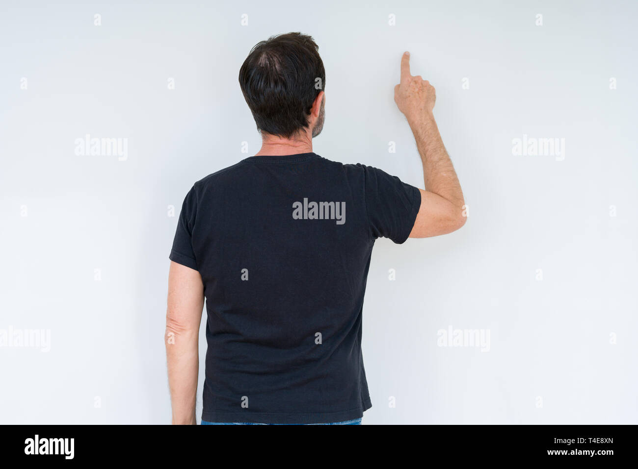 Senior man over isolated background Posing backwards pointing behind ...