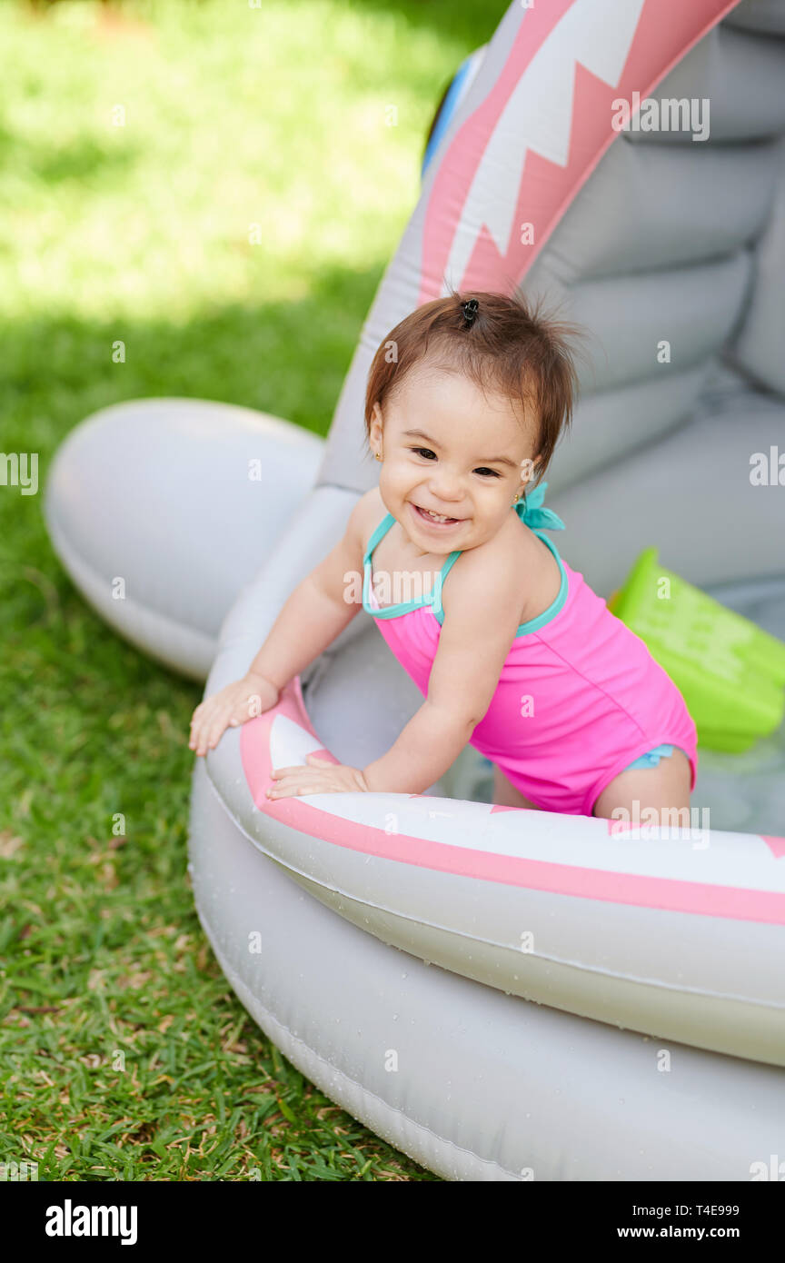 Little kid playing in backyard hi-res stock photography and images - Alamy