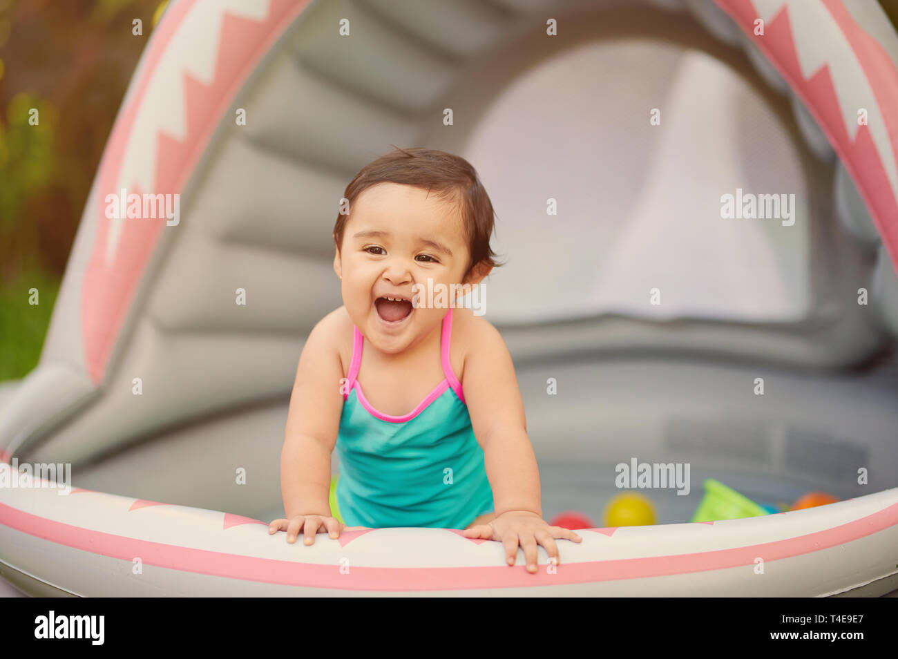 Happy kids playing on slide hi-res stock photography and images - Alamy