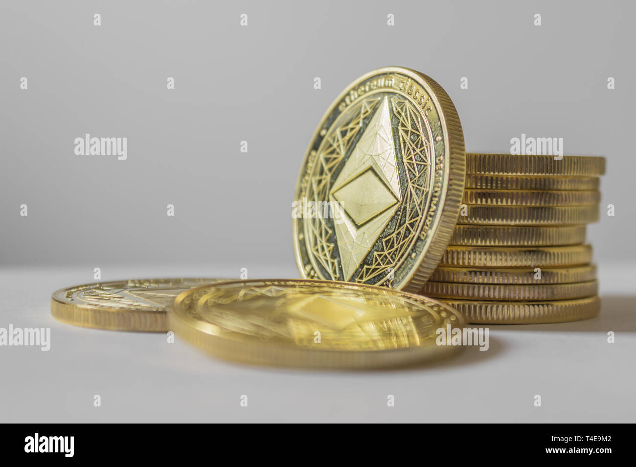 Golden Etherium coin close up on white background Stock Photo - Alamy