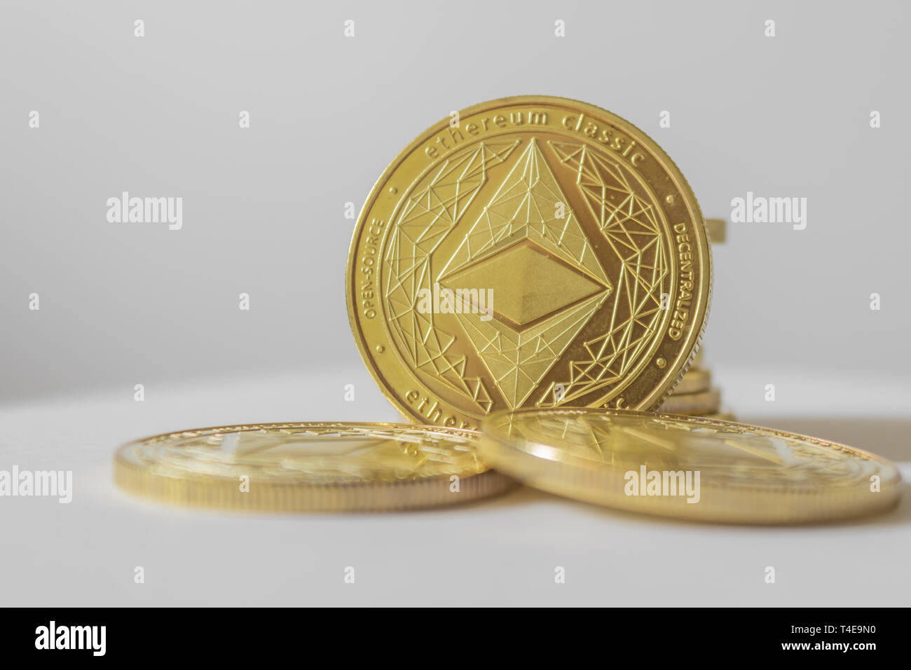 Golden Etherium coin close up on white background Stock Photo - Alamy