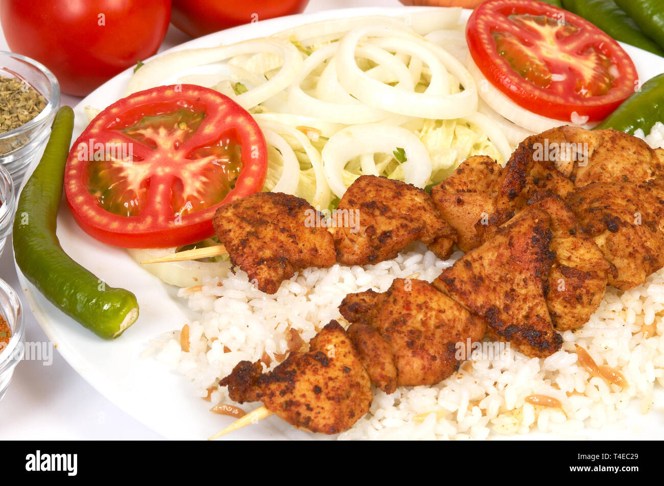 Chicken fillet ready to serve with rice and salads Stock Photo - Alamy
