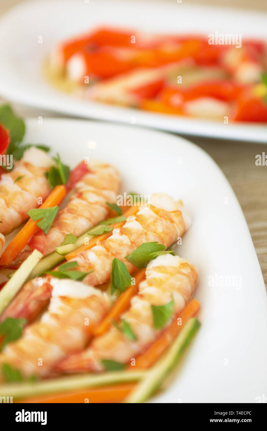 shrimp prepared with salads at the restaurant Stock Photo - Alamy