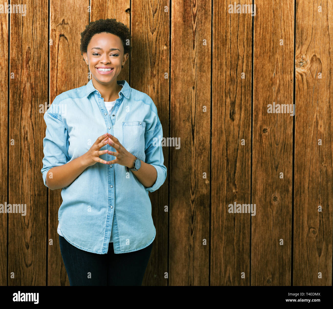 Young beautiful african american woman over isolated background Hands ...