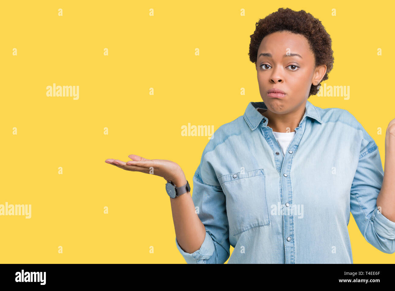 Young beautiful african american woman over isolated background ...