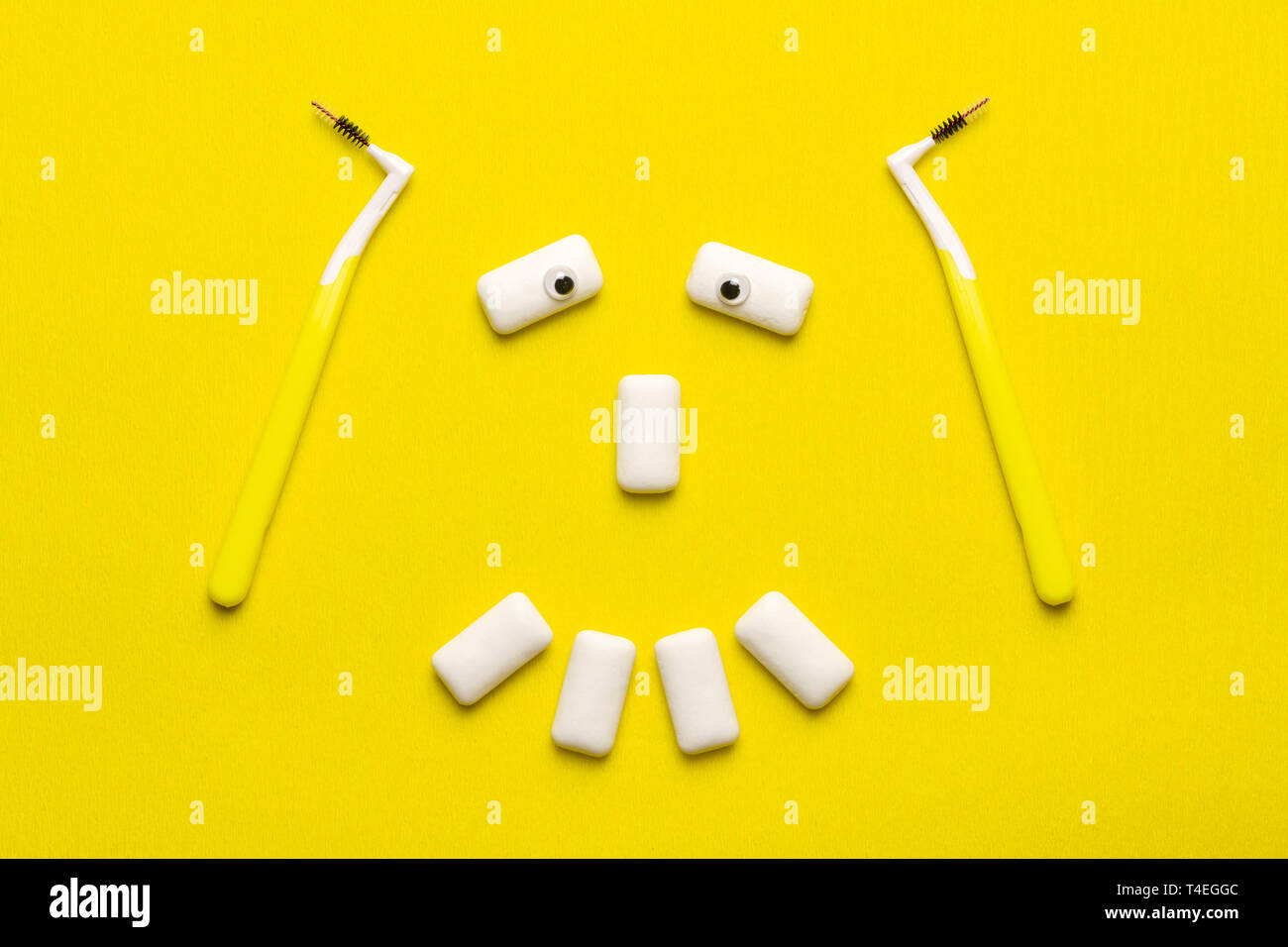 Braces cleaning funny concept with smile face shaped chewing gums pads ...