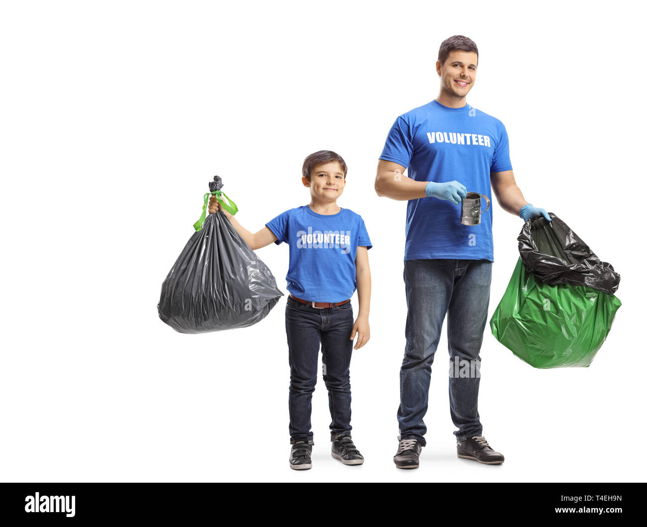 Full length portrait of a young man and a child volunteers collecting ...