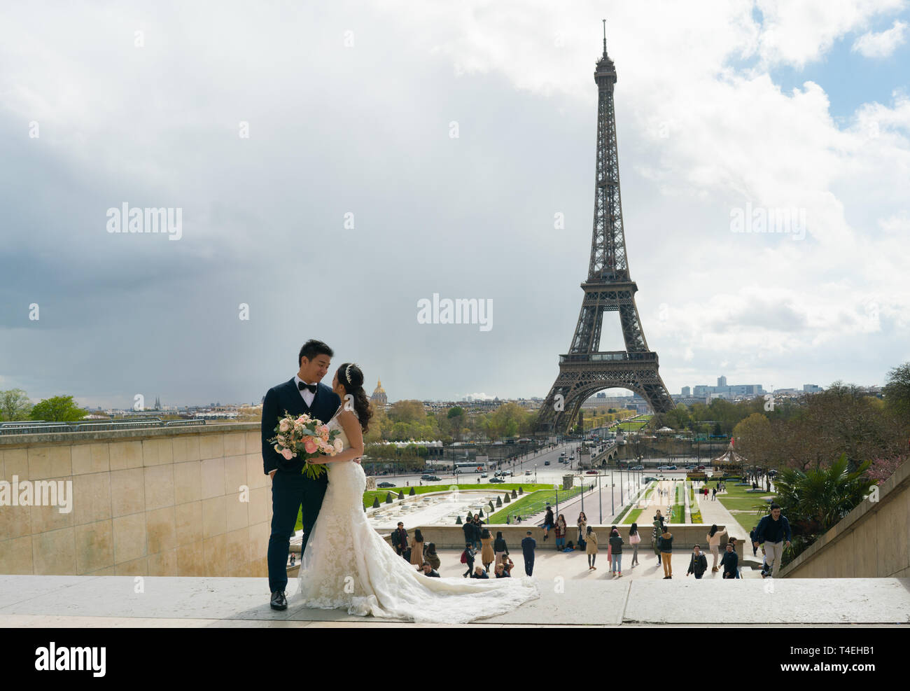 Paris, France - April 3, 2019: Newly married asian couple posing for ...