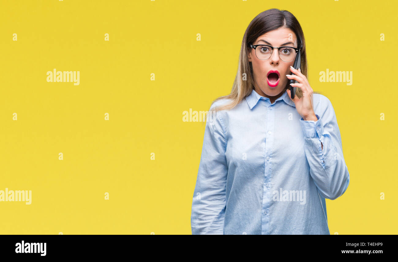 Young beautiful business woman speaking calling using smartphone over ...