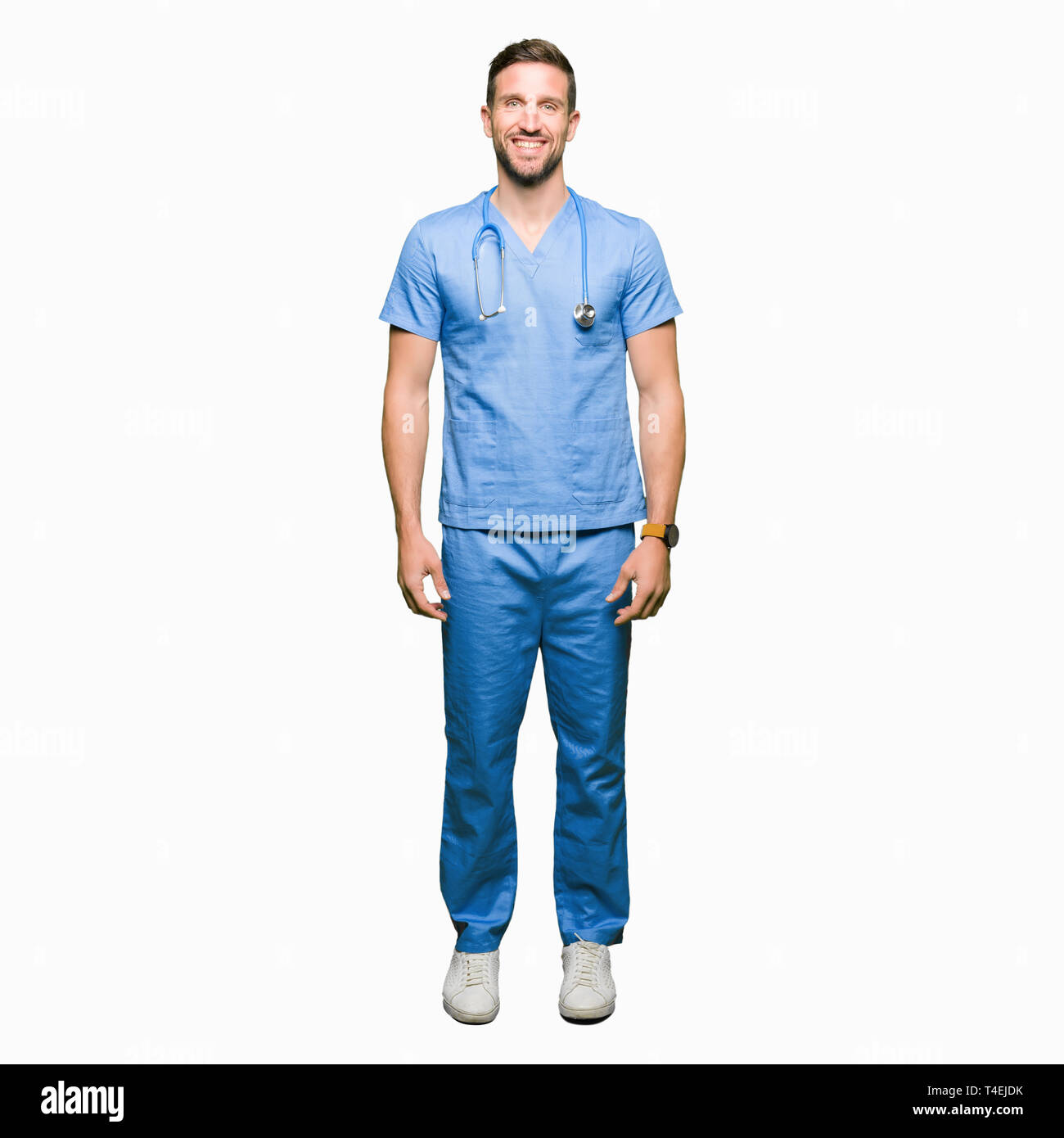 Handsome doctor man wearing medical uniform over isolated background ...