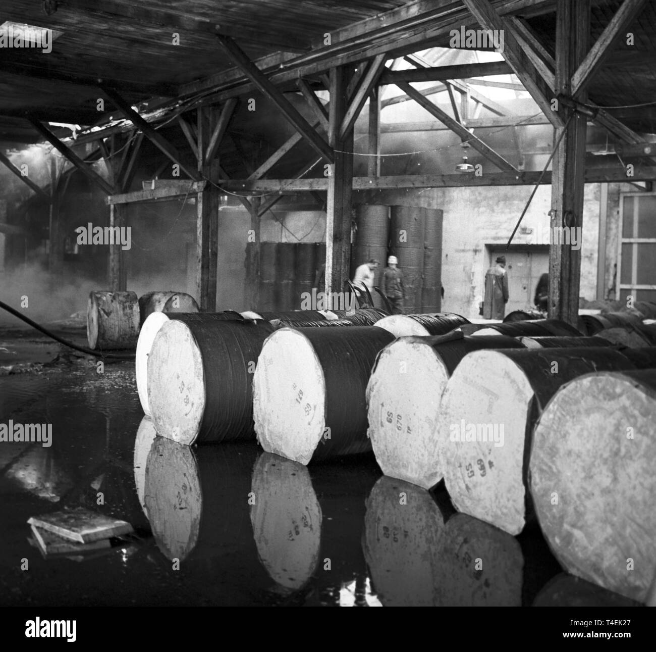 View into the store room of a paper factory flooded by fire water, in ...