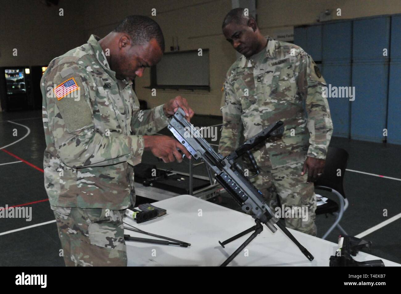 Sgt. 1st Class Newton Severin looks on as Sgt. Leon Perkins, Recruiting ...