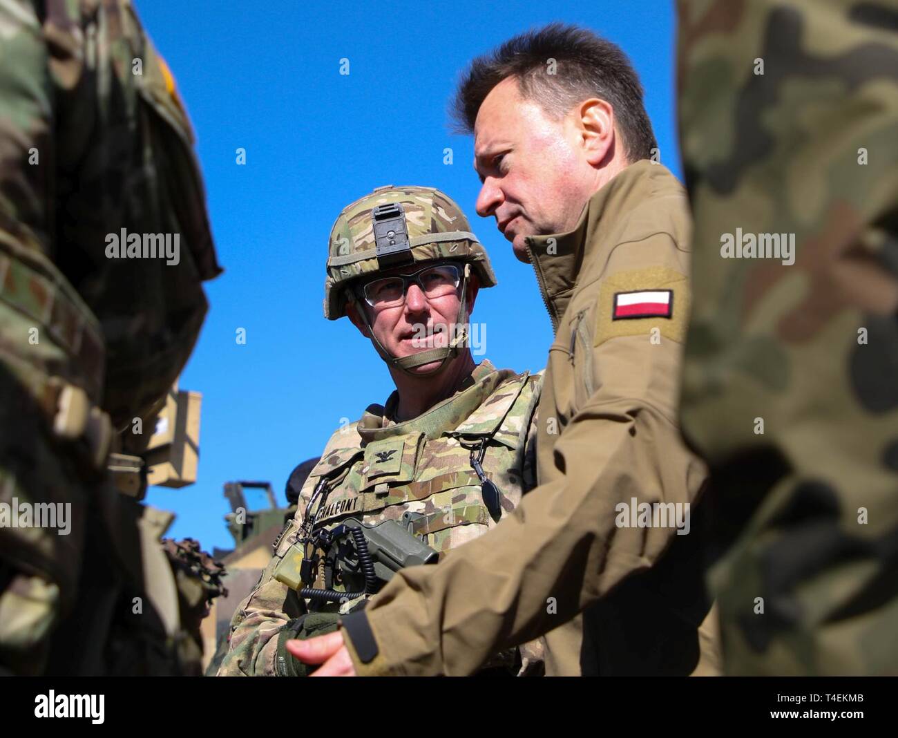 Mariusz Blaszczak, Polish Minister of National Defense, speaks with Col ...
