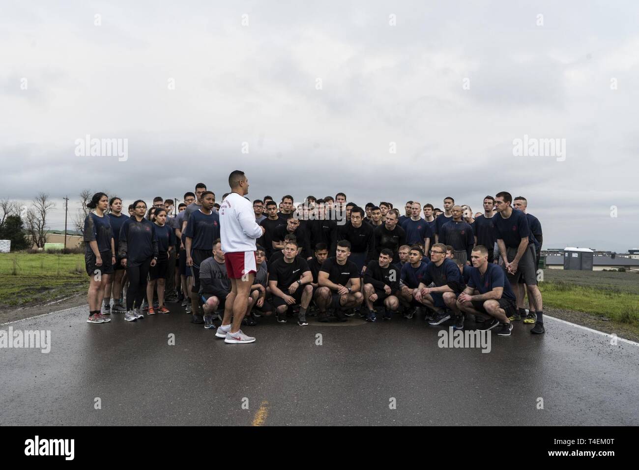 U.S. Marine Corps Gunnery Sgt. Juan Aguilera (center left), a Physical ...