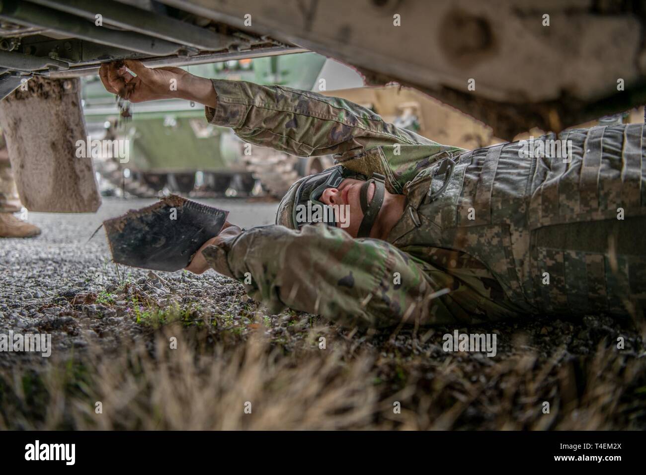 Pfc. Joseph Vosahlo, a multiple launch rocket system crewmember ...