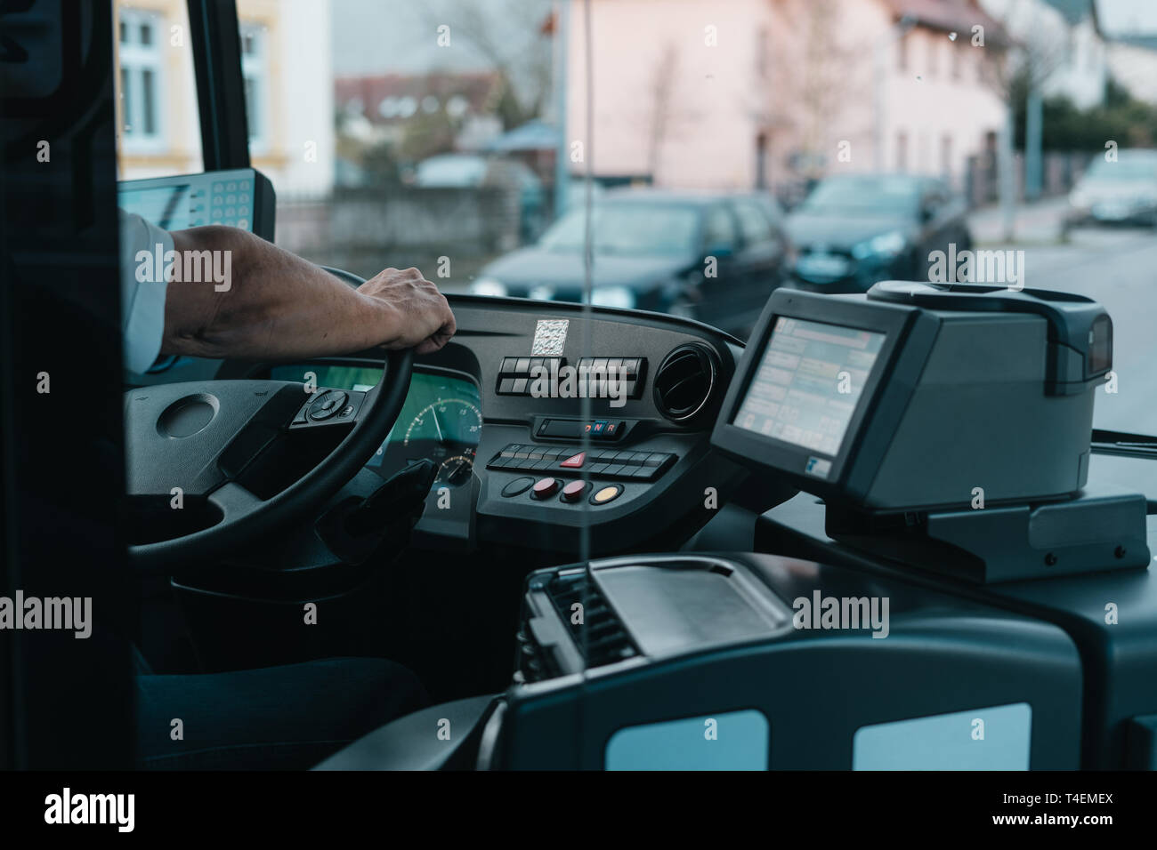 Modern bus interior with drivers hand Stock Photo - Alamy