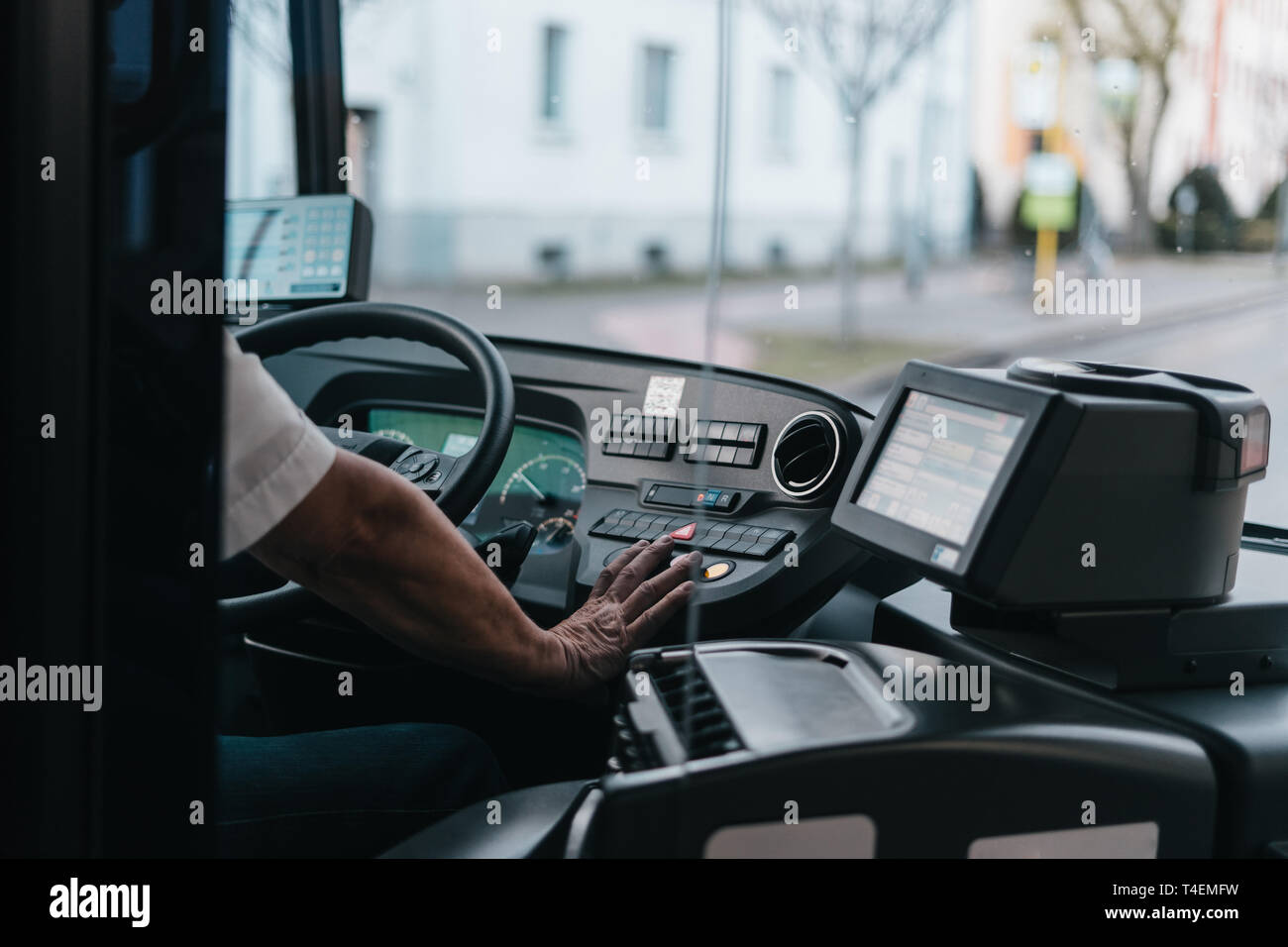 Modern bus interior with drivers hand Stock Photo - Alamy