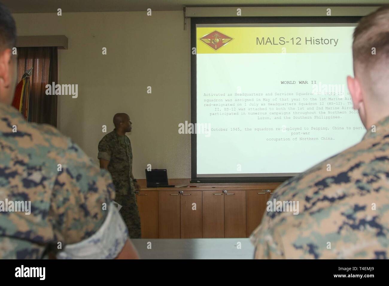 U.S. Marine Corps Sgt. Maj. Lester Williams, center, sergeant major of ...