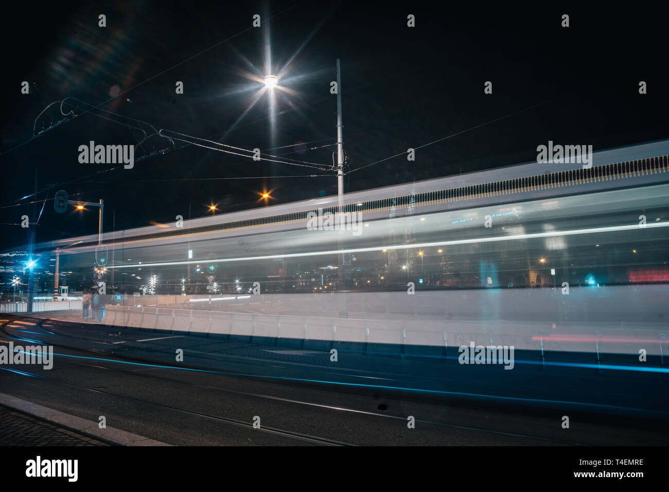 Tram light trails at night european capital Stock Photo - Alamy
