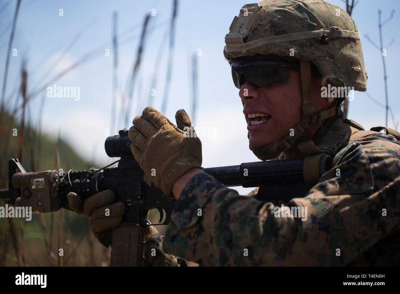U.S. Marine Corps Lance Cpl. Hector Rivera-Fuentes calls out commands ...