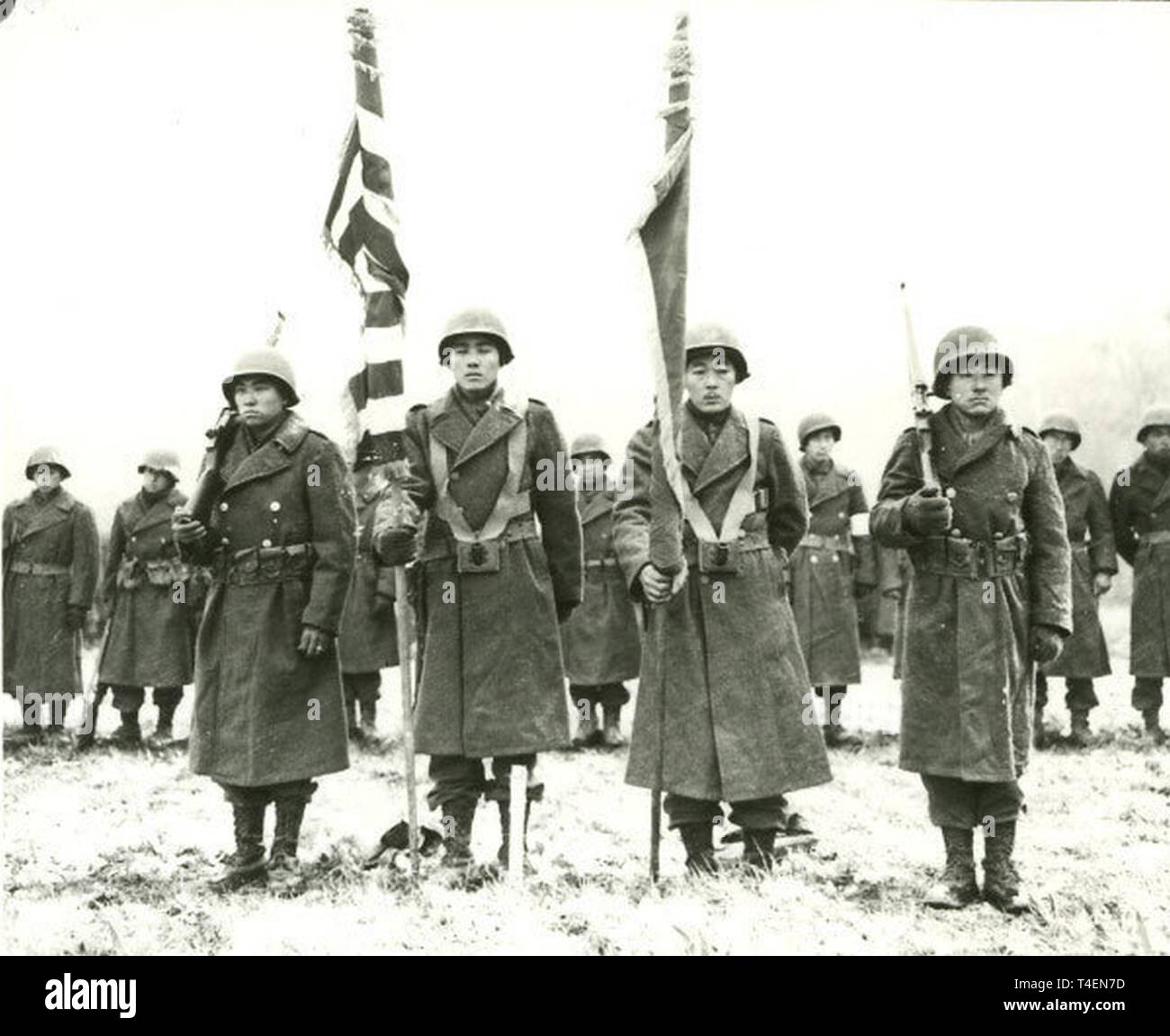 The Color Guard of the 442nd Regimental Combat Team stands at attention ...