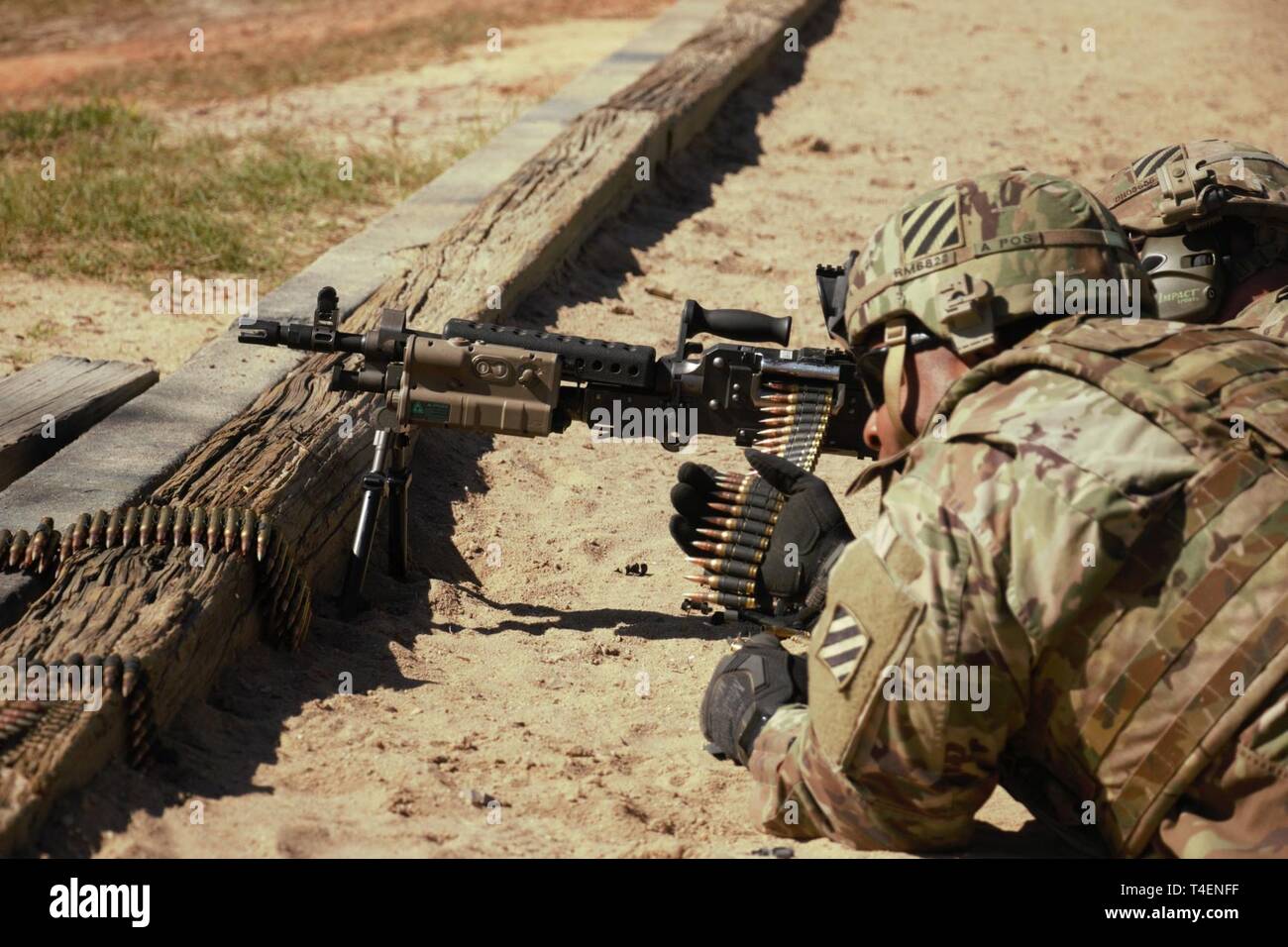 Spc. Ralph Miller (front), assigned to Headquarters and Headquarters ...
