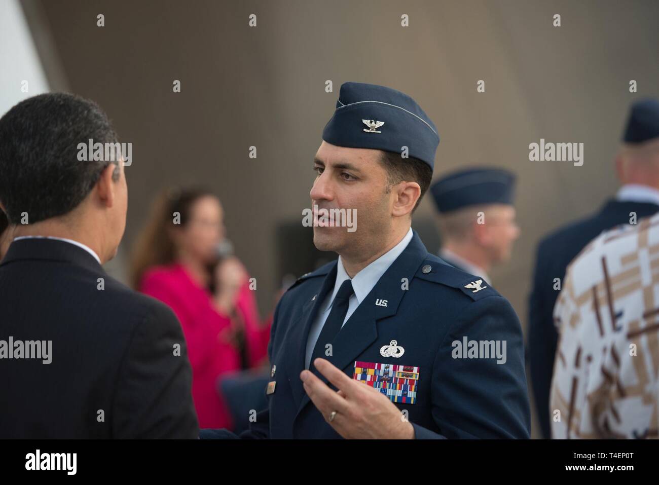 Col. Jason Janaros, 37th Training Wing, commander, speaks with other distinguished guests prior ...