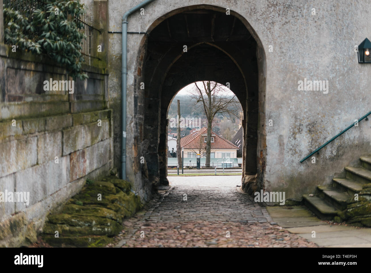 Medieval european castle arch with view on street Stock Photo - Alamy