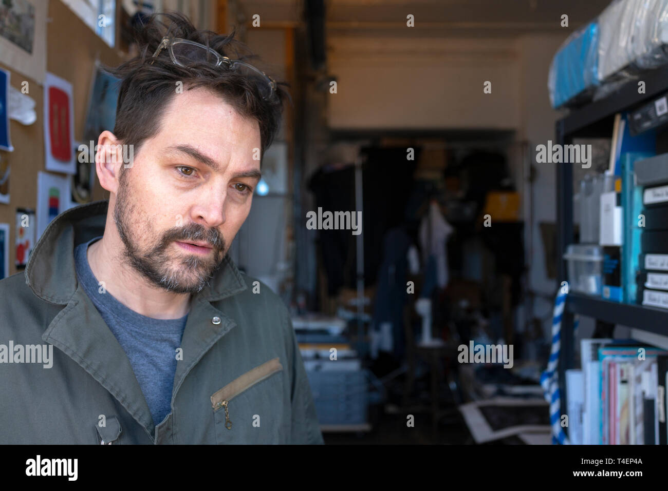 man looking across frame at work Stock Photo - Alamy