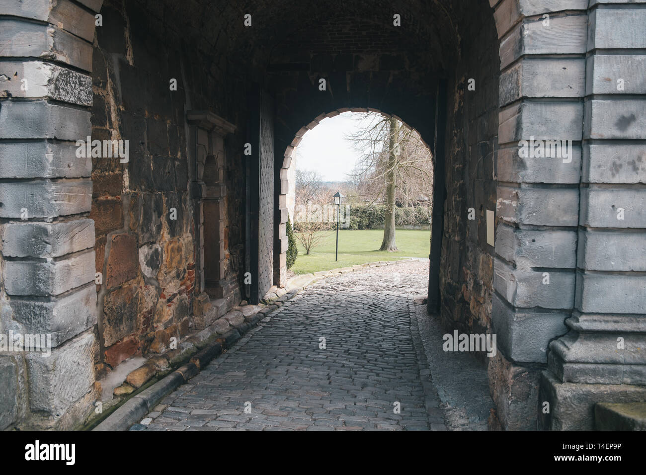 Medieval european castle arch with view on street Stock Photo - Alamy
