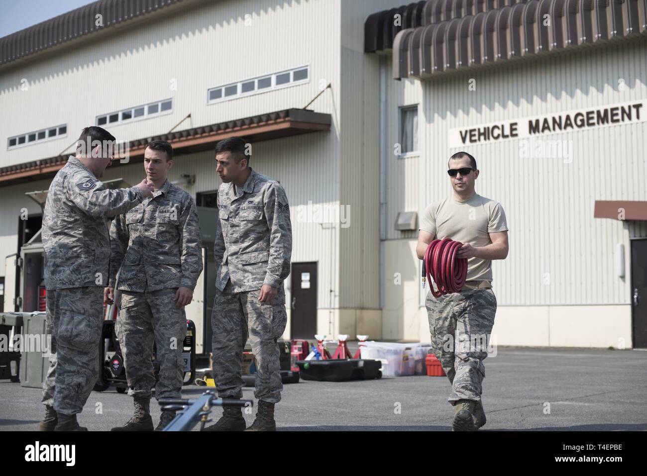 Airmen with the 35th Logistic Readiness Squadron discuss operations and ...