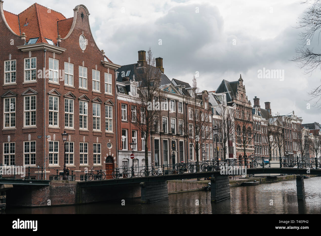 Cozy european architecture with river canal. Amsterdam beautiful houses ...