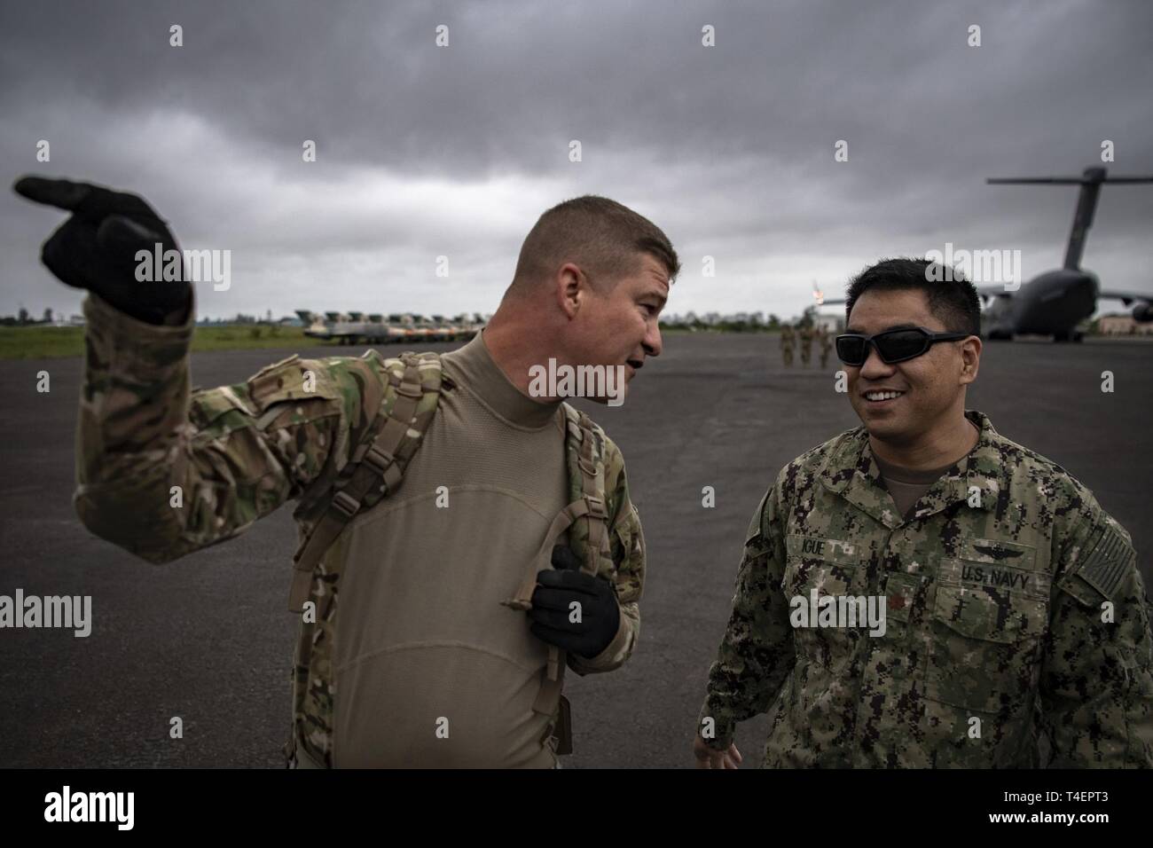 U.S. Air Force Master Sergeant Pat Wagnon and Lt. Cmdr. Rob Igue ...