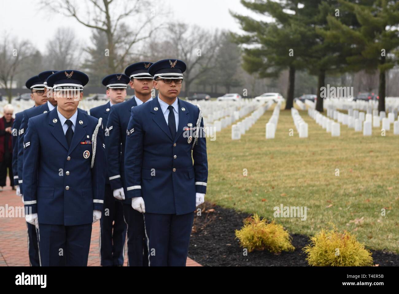 An Air Force Honor Guard team stands at attention during the funeral ...