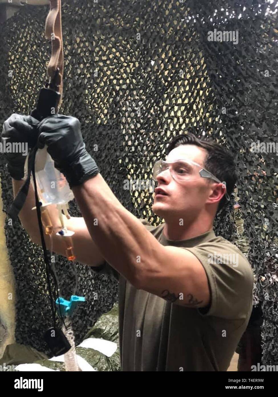 Students in the Tactical Combat Medical Care (TCMC) Course work as a ...