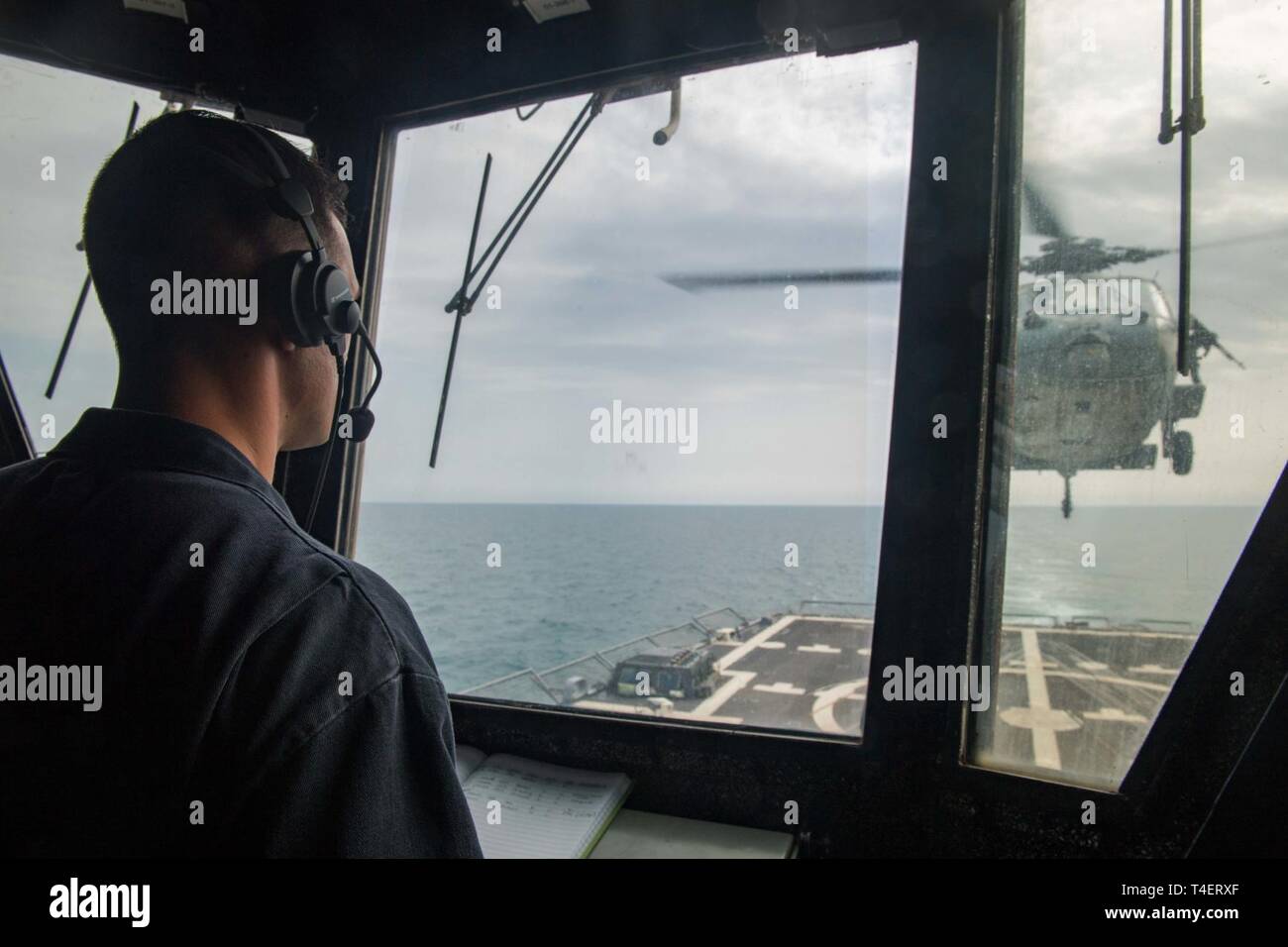 U.S. Navy Lt. Jacob Pilarski, from Garnet Valley, Pennsylvania, watches ...