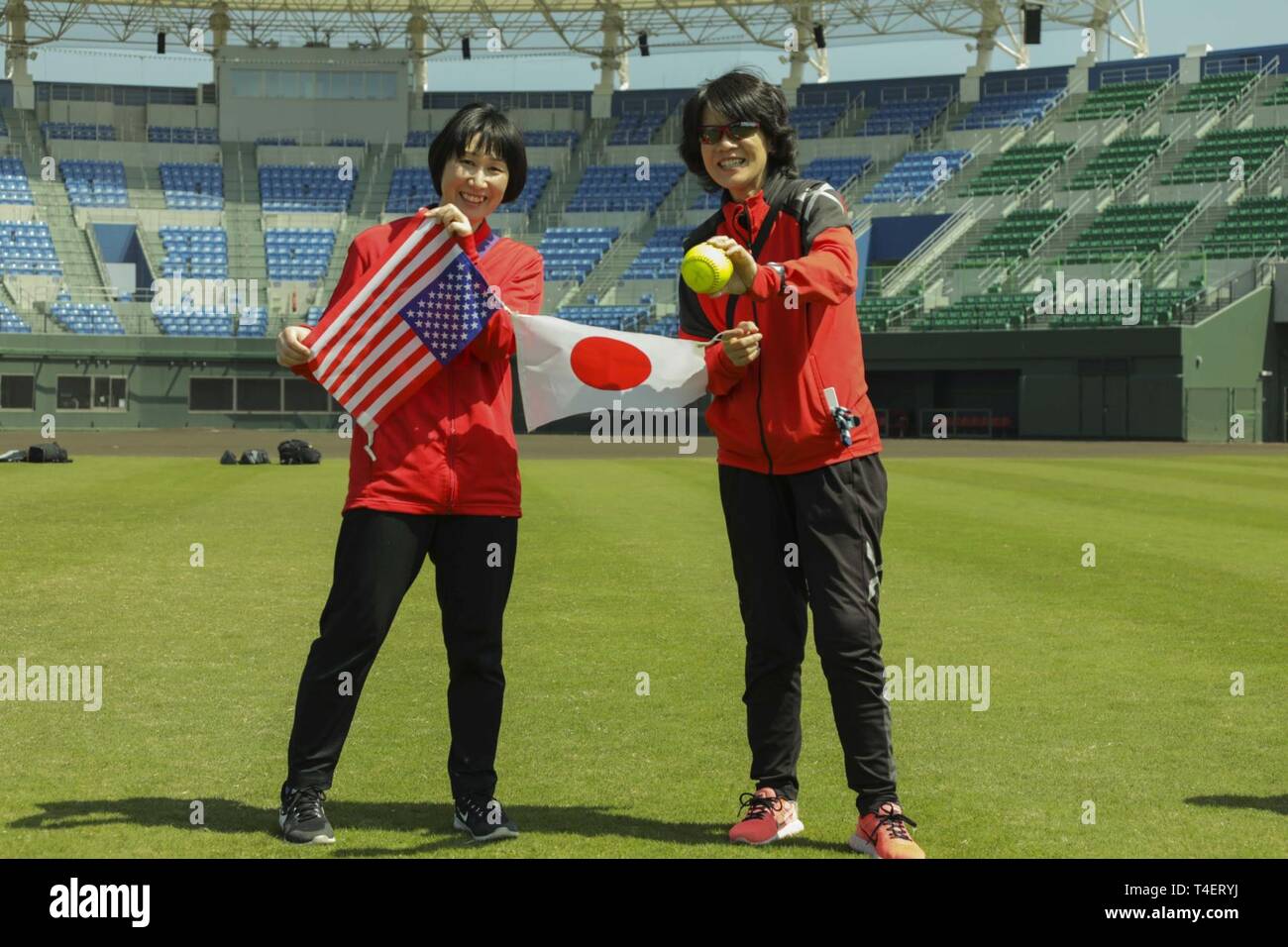 Two Japanese nationals show their excitement during a signing agreement ...