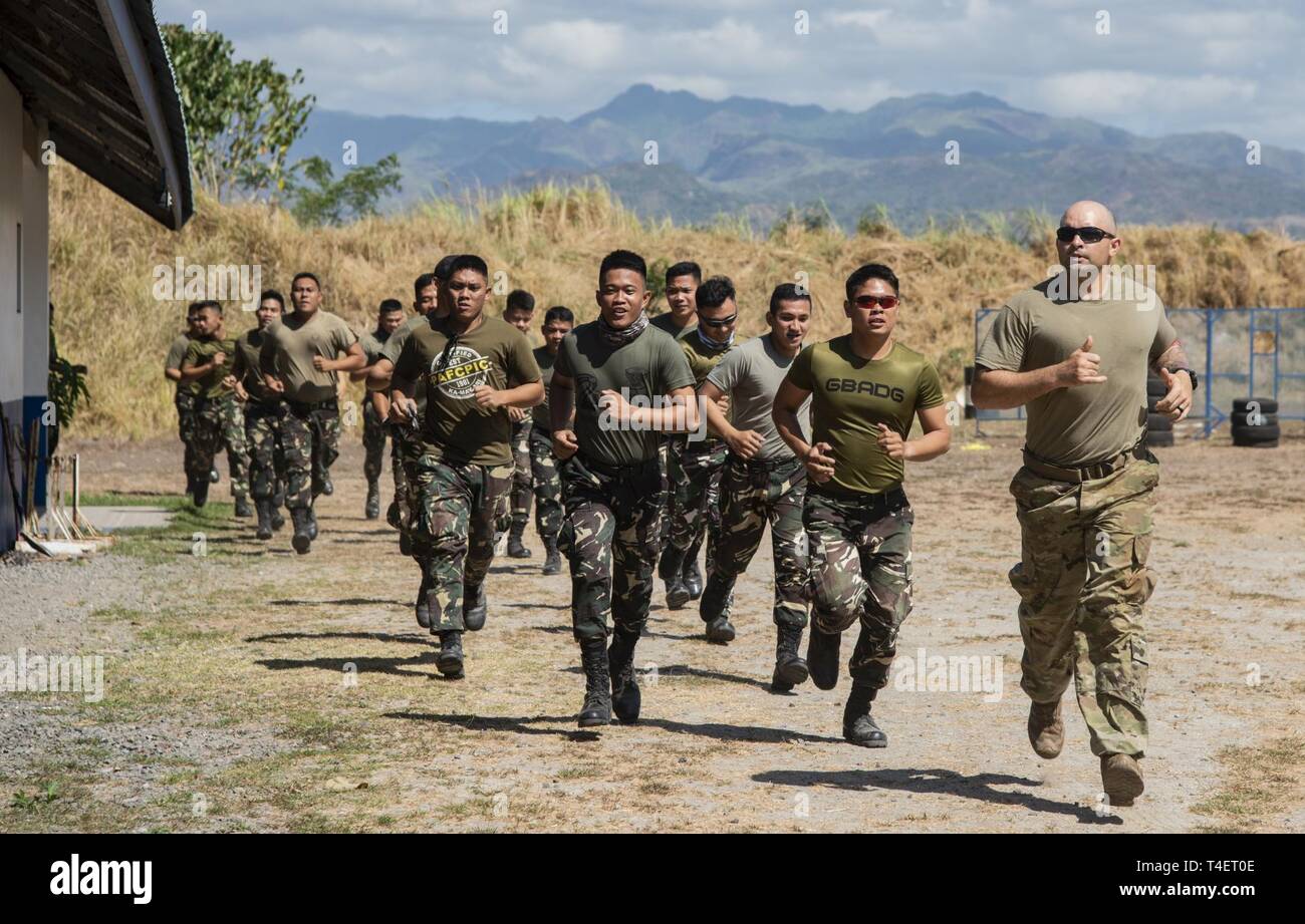 U.S. Air Force Tech Sgt. Robert Keefe runs with Philippine Air Force ...