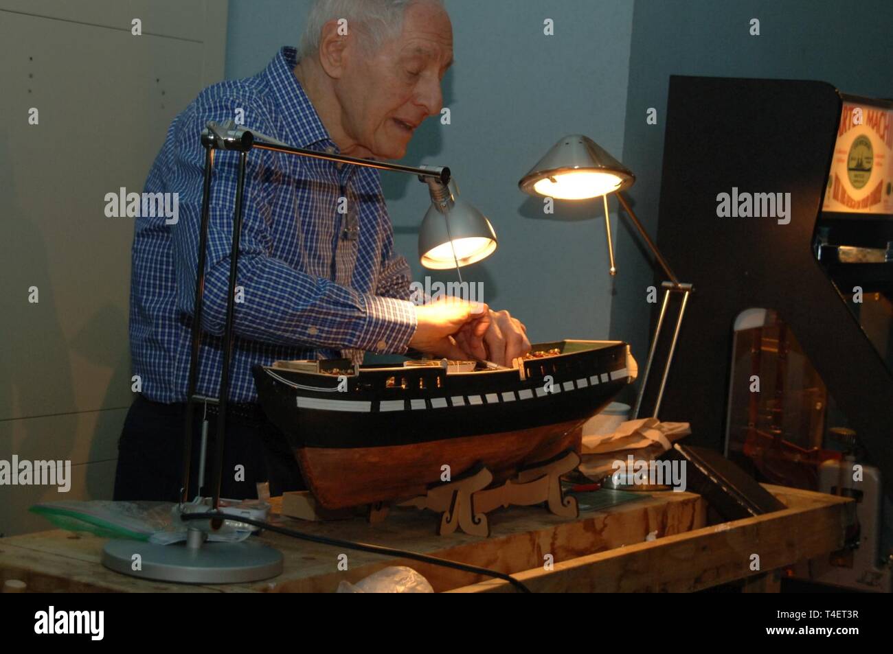 Model Ship Builder, Lee Martin, is pictured working on a detailed model ...