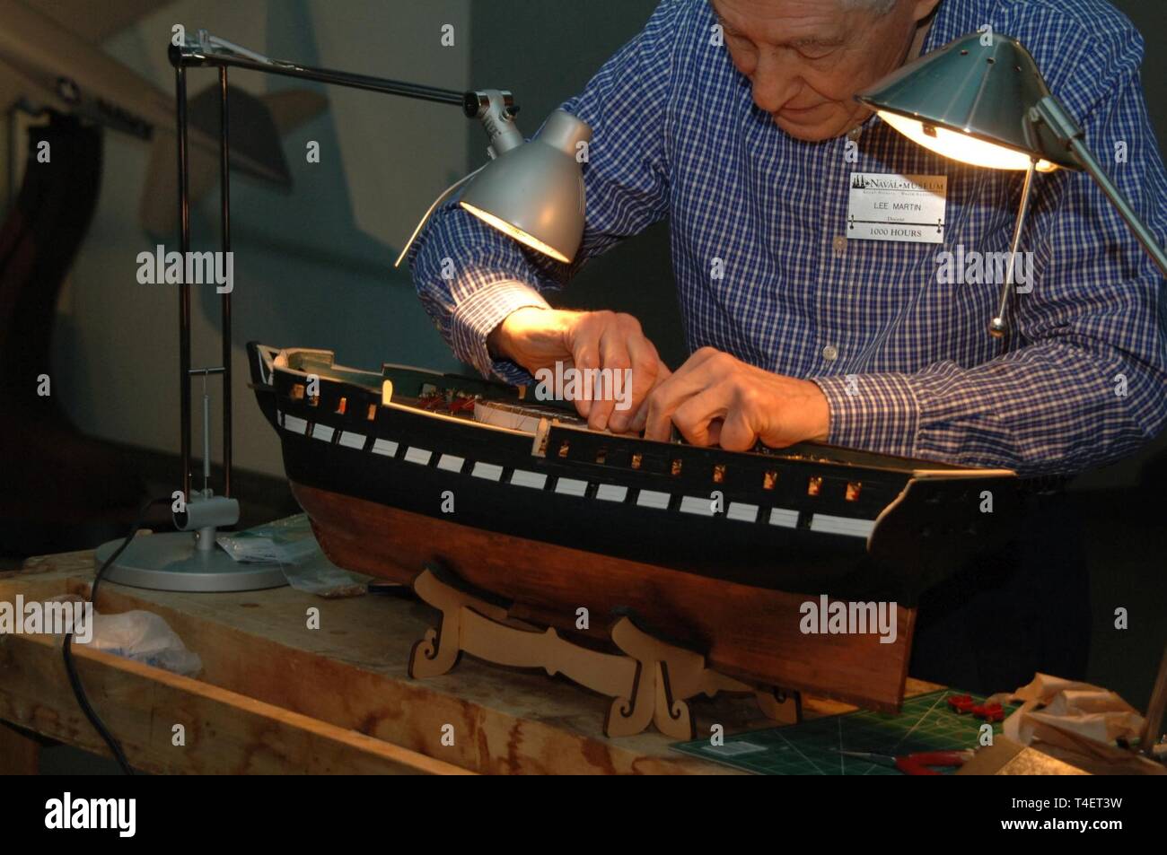 Model Ship Builder, Lee Martin, is pictured working on a detailed model ...