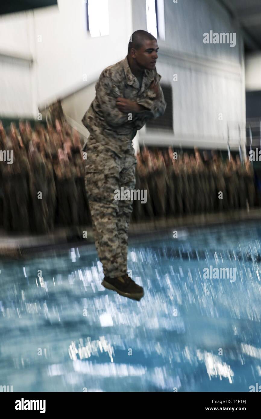 A Recruit with Hotel Company, 2nd Recruit Training Battalion, jumps ...