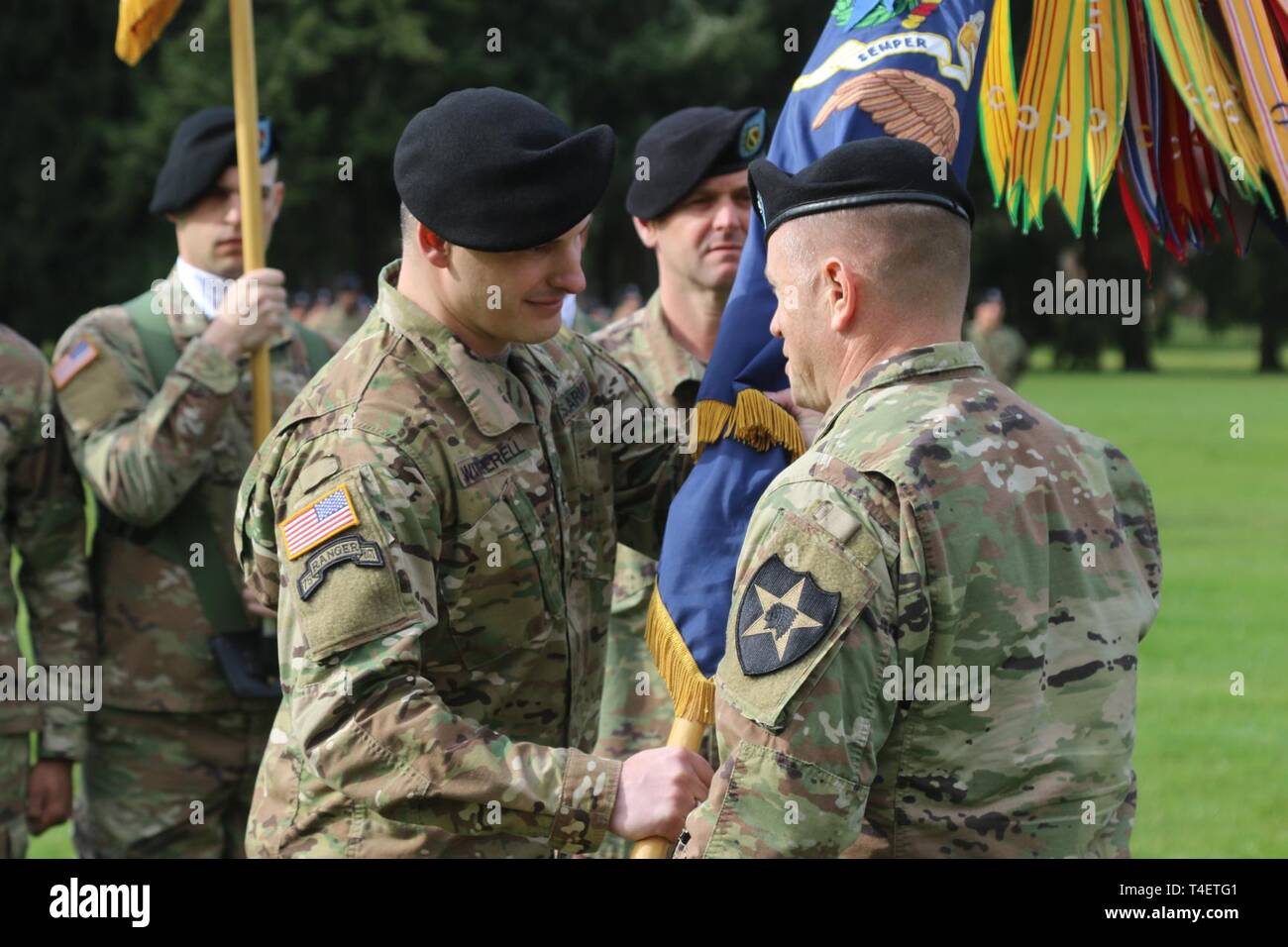 Lt. Col. Blake Wetherell accepts the Legion colors from Col. Jay Miseli ...